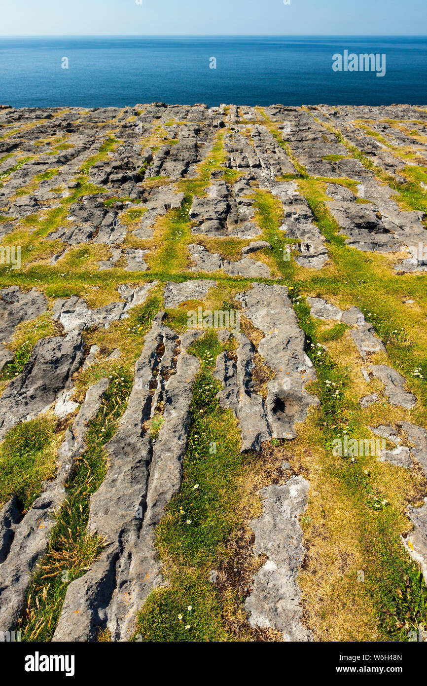 Rock and grass landscape of Inishmore Island along the coast of Ireland ...