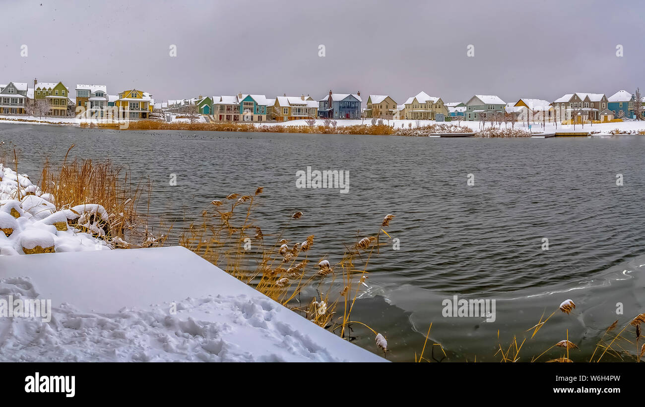 Panorama Silvery lake with a pavilion built on the shore covered with ...