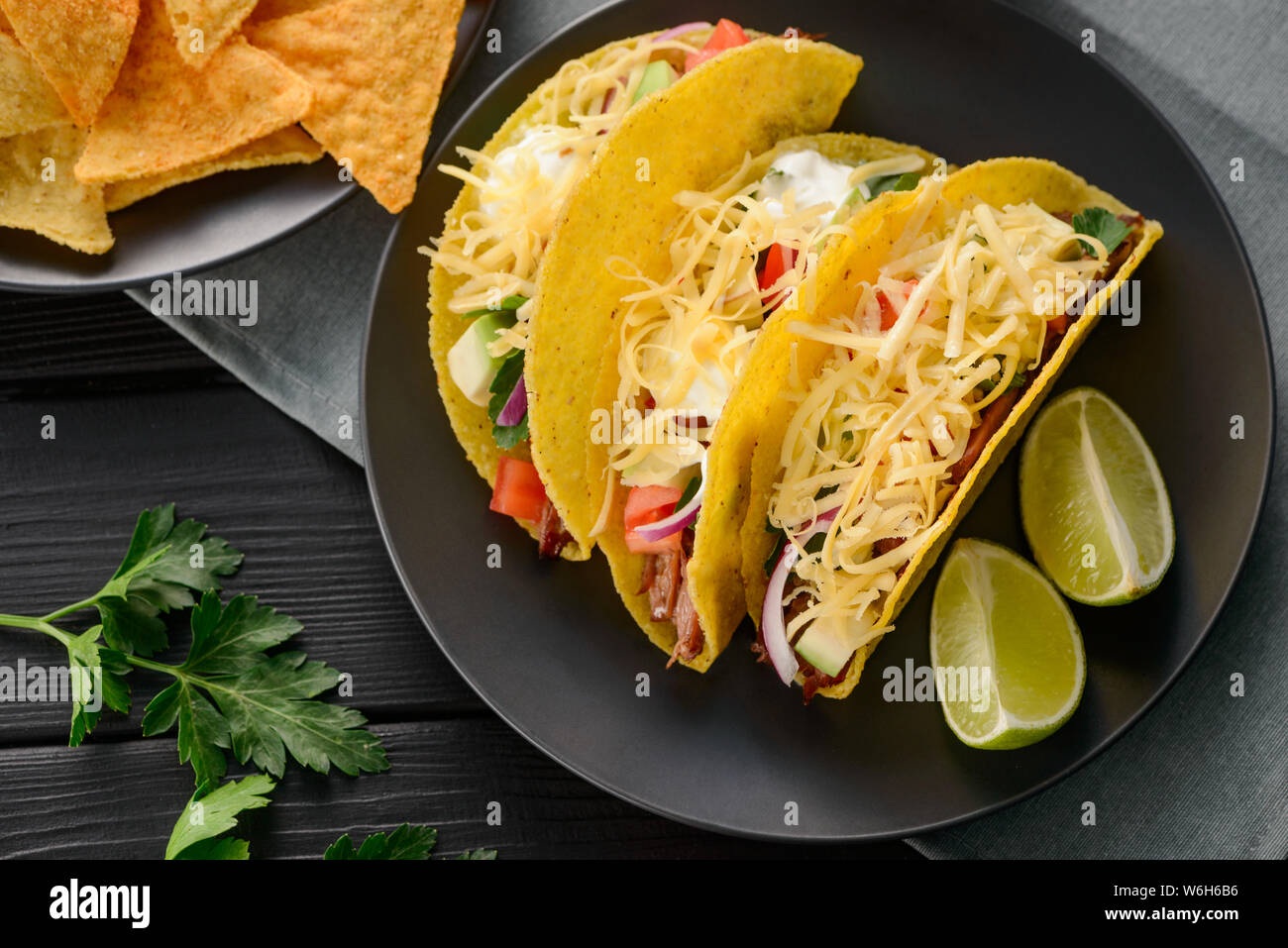 Hard-shell tacos and nachos Stock Photo - Alamy