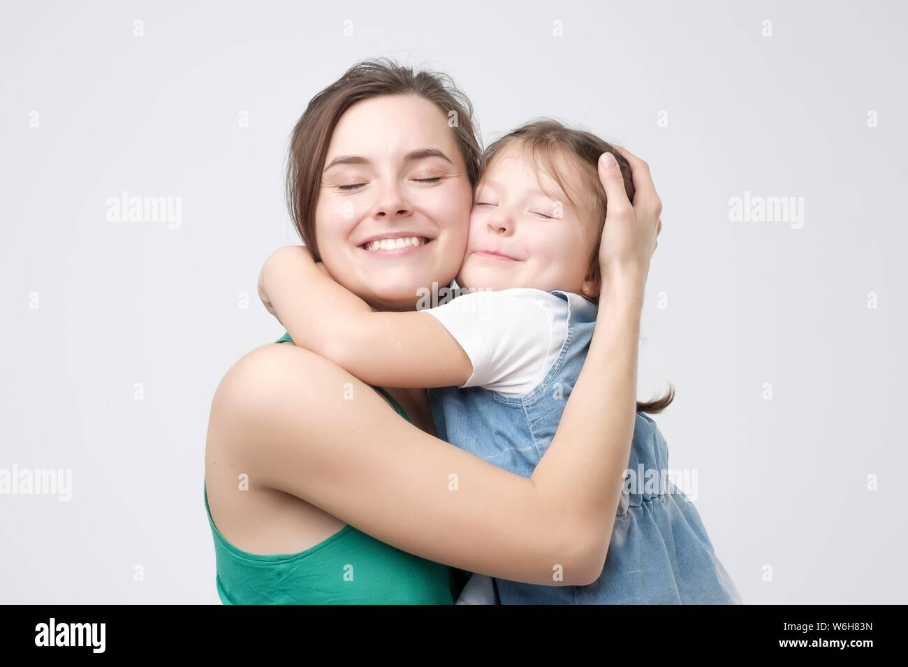 Woman hugging her cute child baby girl Stock Photo - Alamy