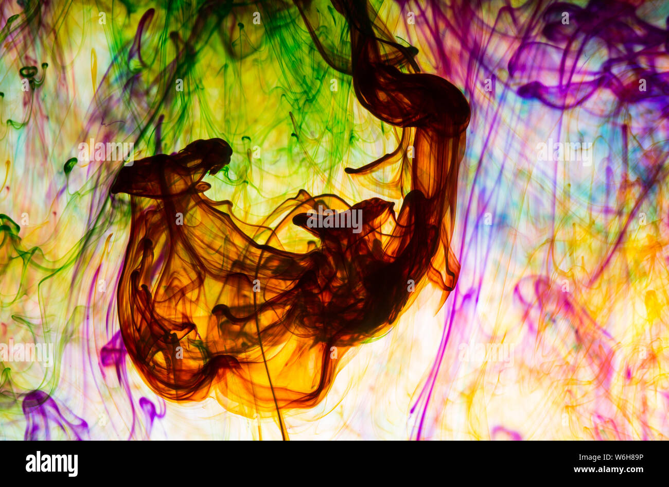 Acrylic colors and ink in water. Abstract background Stock Photo - Alamy