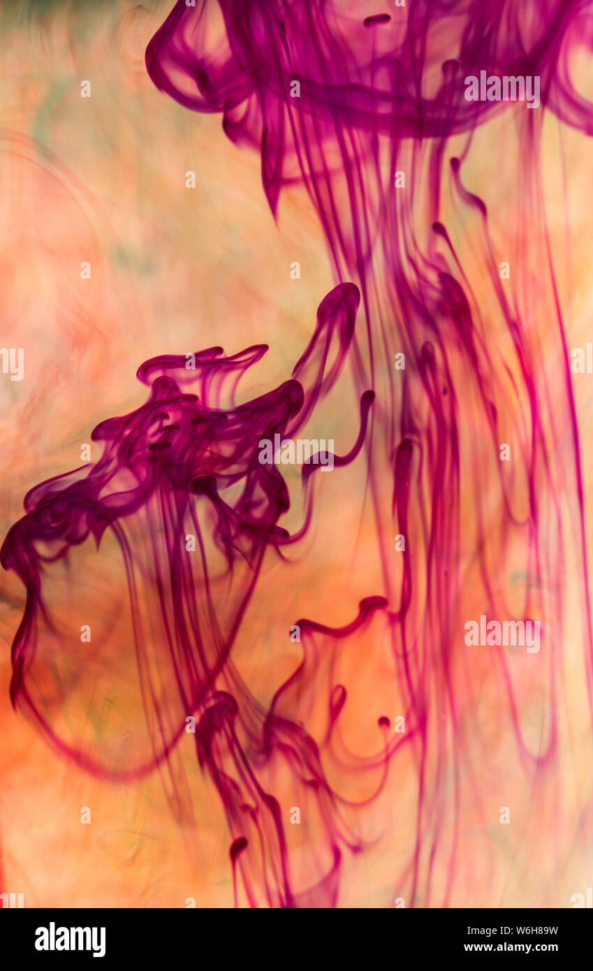Acrylic colors and ink in water. Abstract background Stock Photo - Alamy