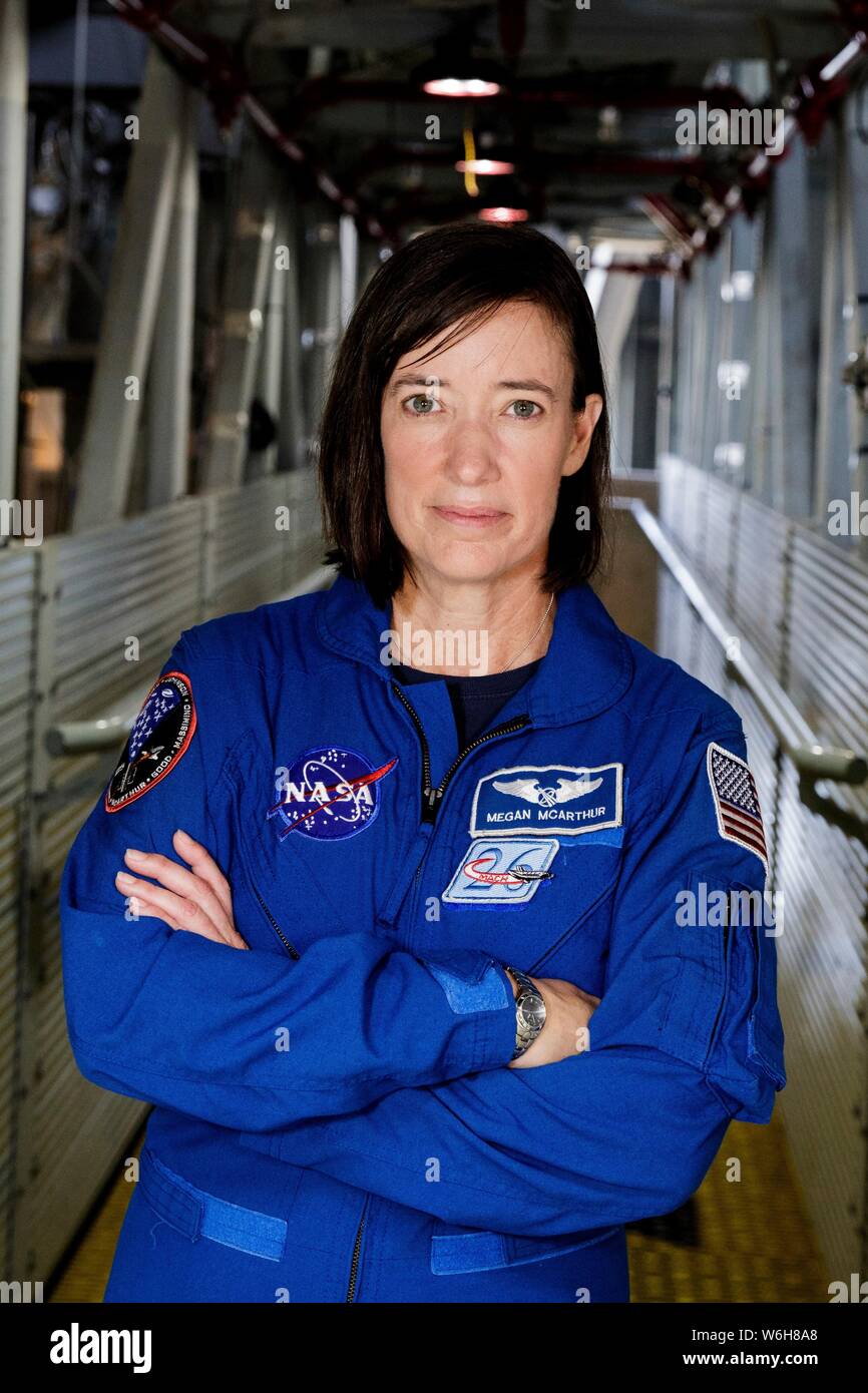 NASA astronaut Megan McArthur poses for a portrait wearing the blue ...