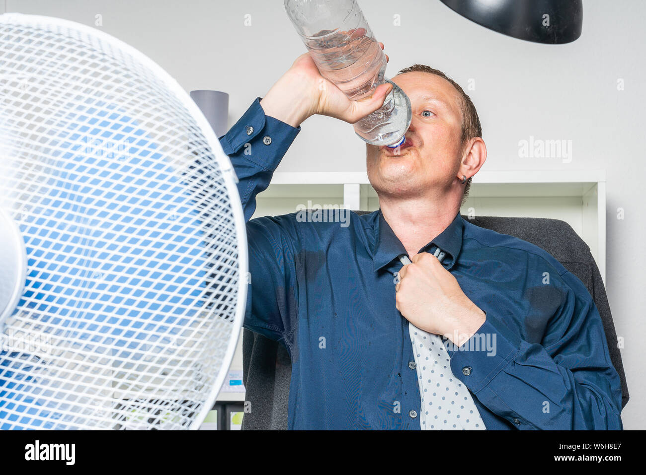 Sweating office hi-res stock photography and images - Alamy