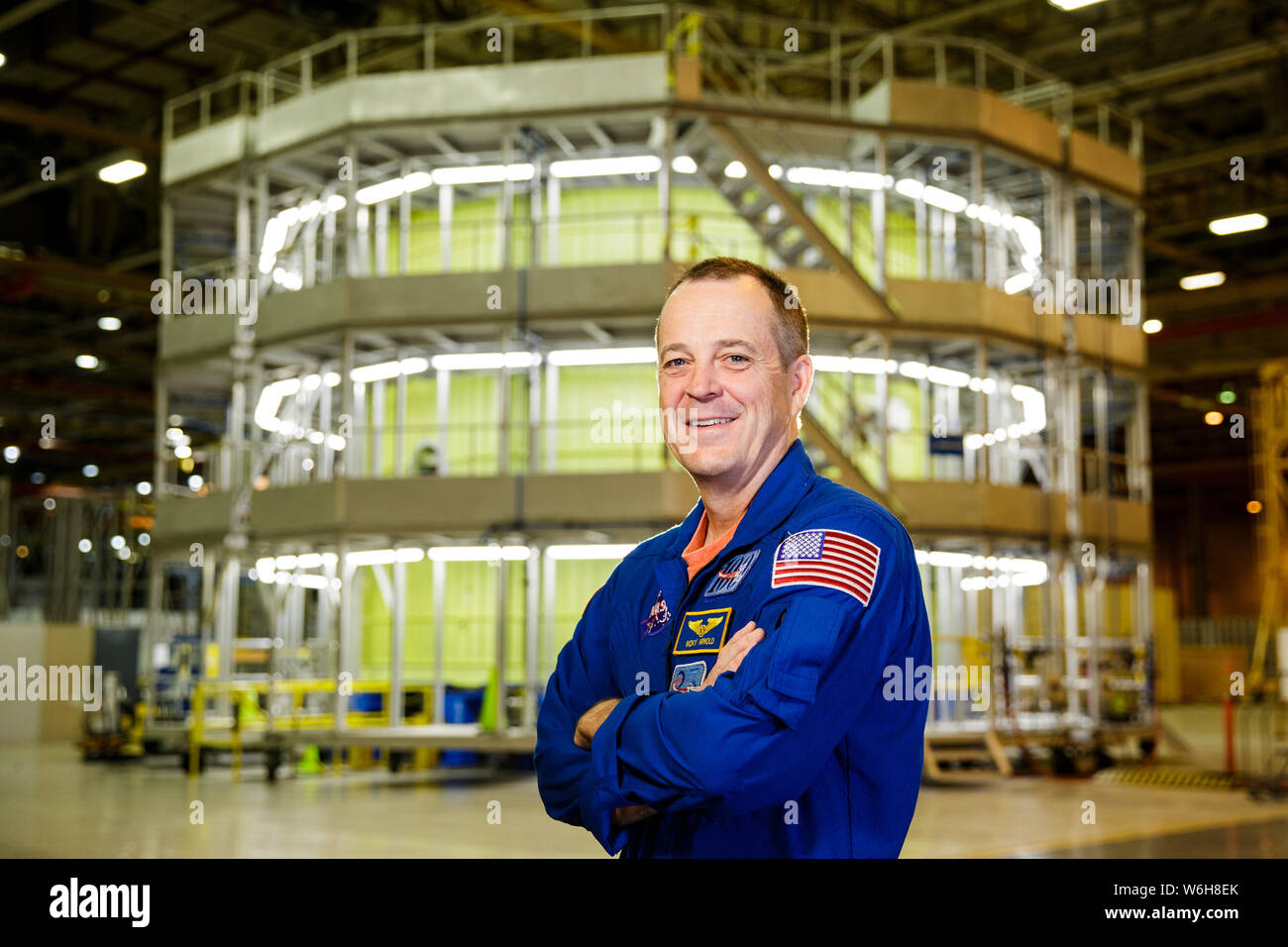 NASA astronaut Ricky Arnold poses for a portrait wearing the blue ...