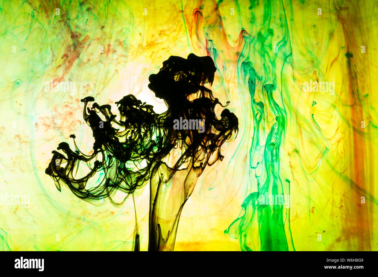 Acrylic colors and ink in water. Abstract background Stock Photo - Alamy