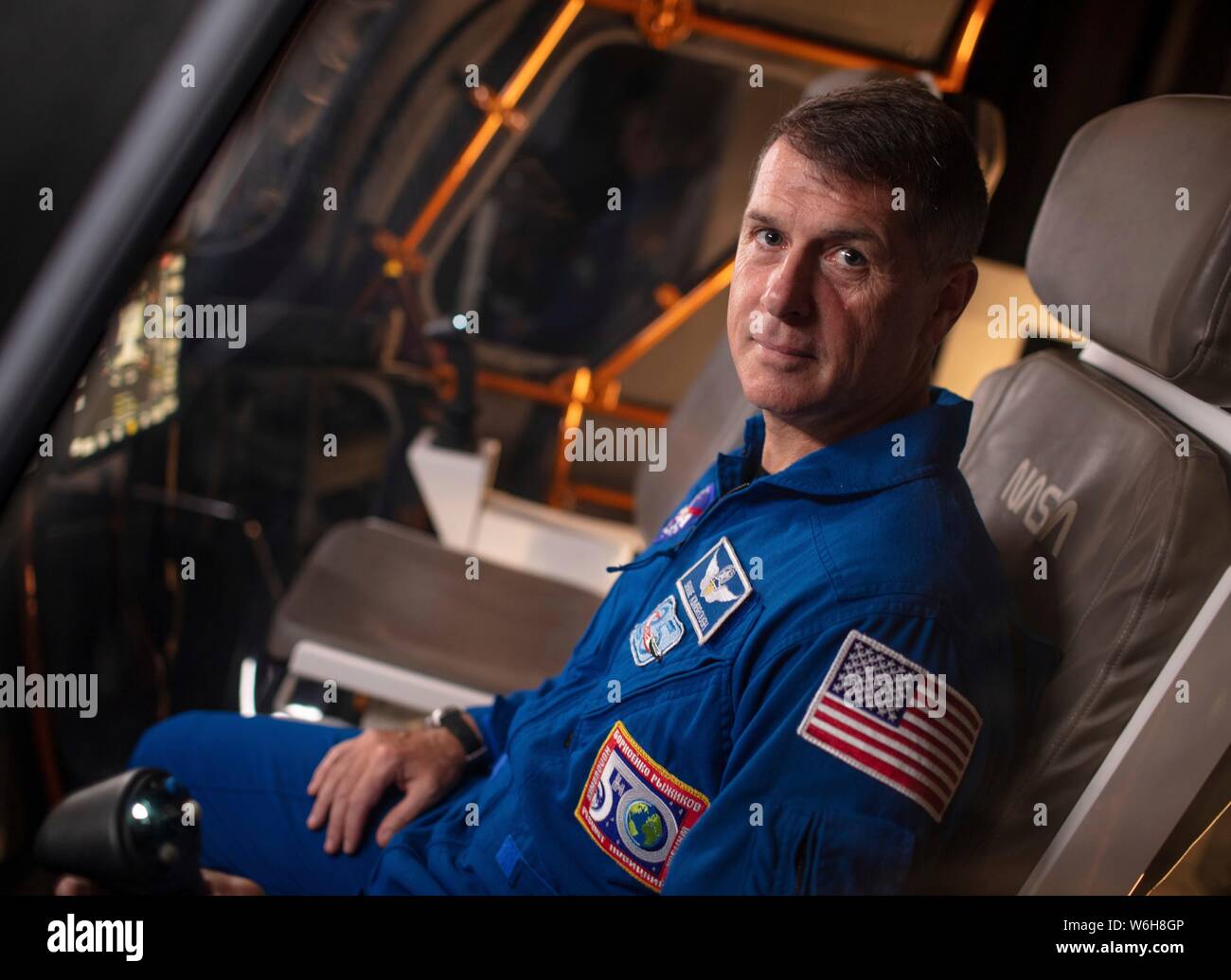 NASA astronaut Shane Kimbrough poses for a portrait wearing a blue ...