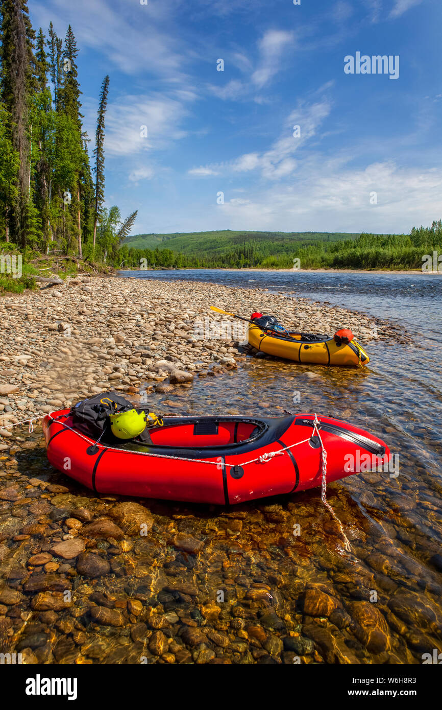 Two pack rafts rest on shore on the Charley River in summer, Yukon ...