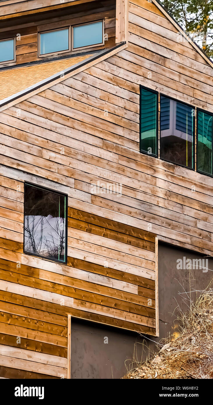 Vertical frame Close up of home exterior with brown horizontal boards ...