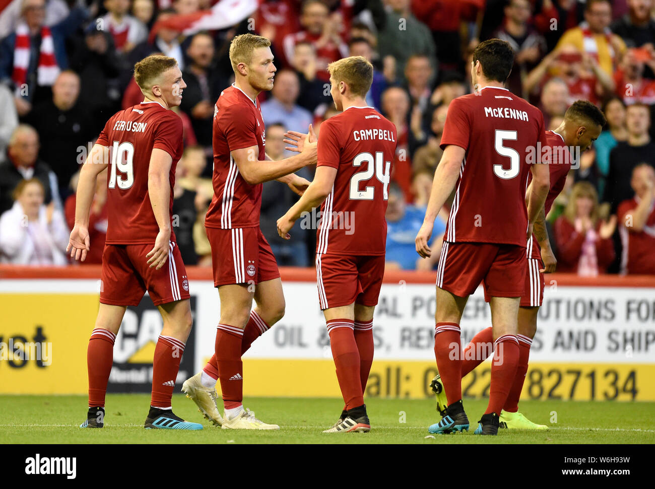 Aberdeens sam cosgrove second left celebrates scoring hi-res stock ...