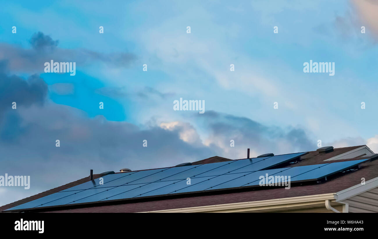 Panorama frame Solar panels installed on the roof of a home with white ...