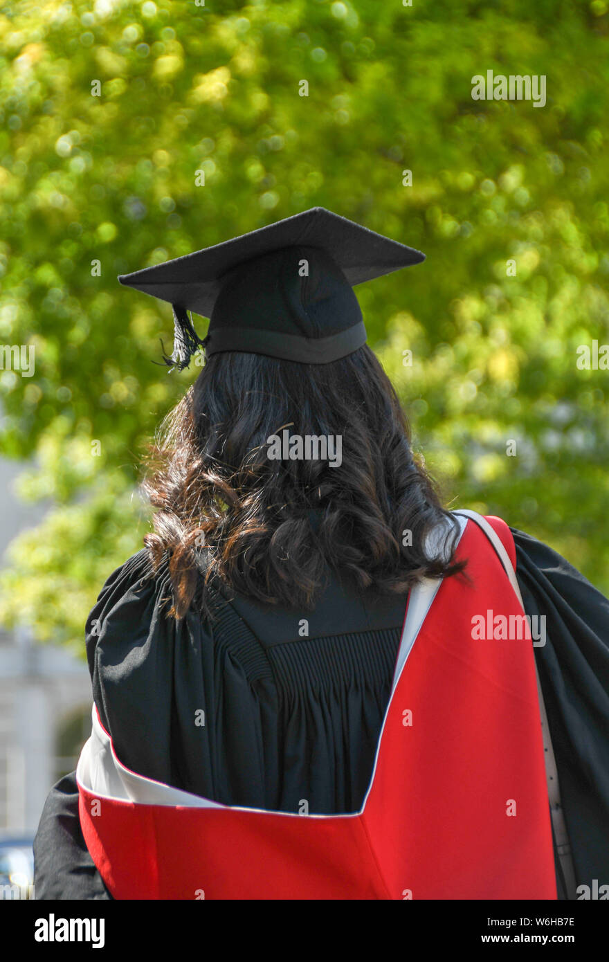 CARDIFF, WALES - JULY 2019: Student with long hair walking in Cardiff ...