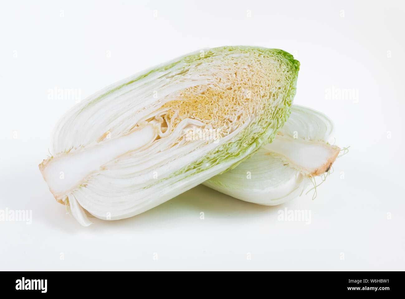 Half of chinese cabbage and pointed cabbage isolated on white ...