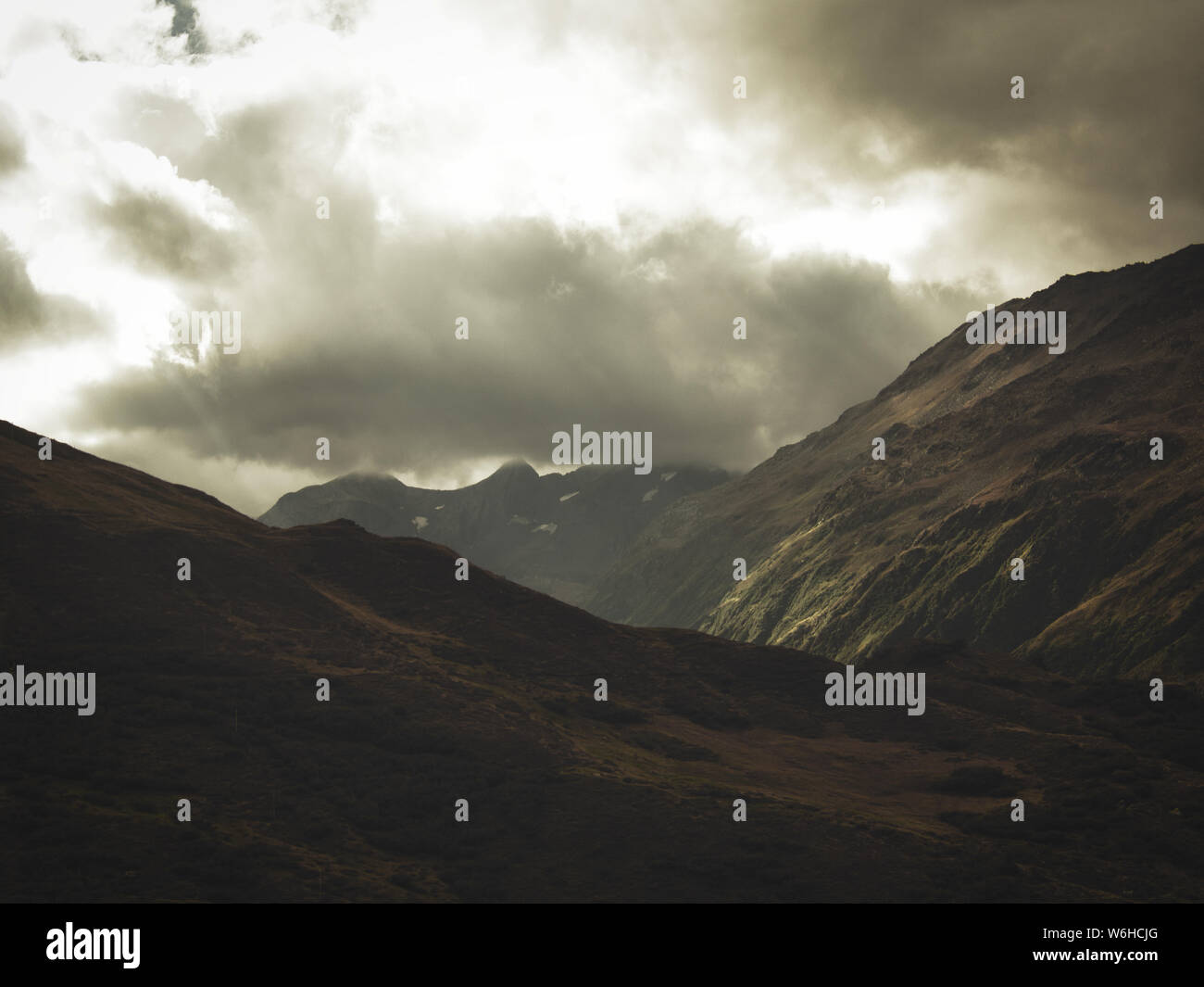 Cloudy Mountains In Swiss Alps Stock Photo - Alamy