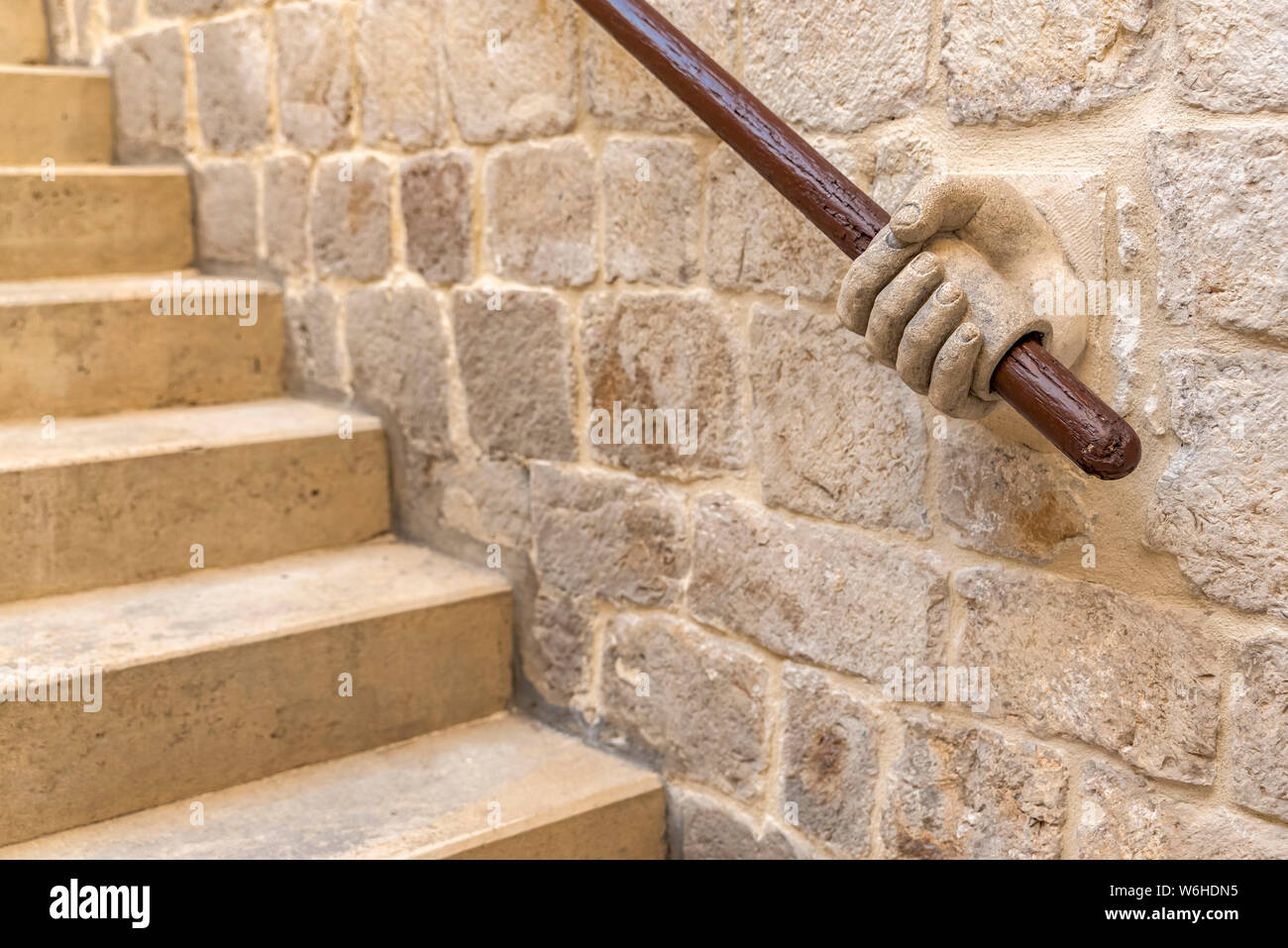 Decorative handrail of human hand holding rail, inside the Rector's ...