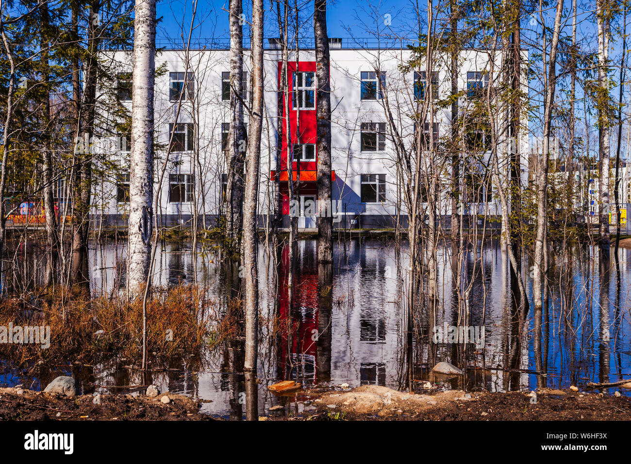 Modern house and a large puddle near it, flooded area Stock Photo - Alamy