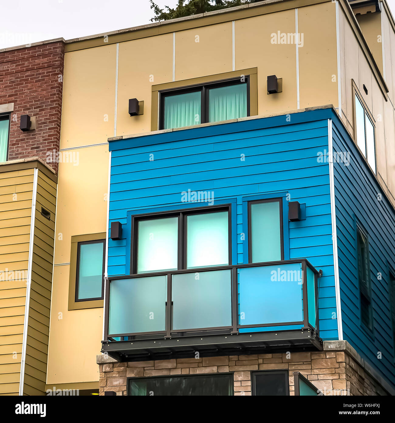Square Residential building with horizontal siding concrete and brick ...