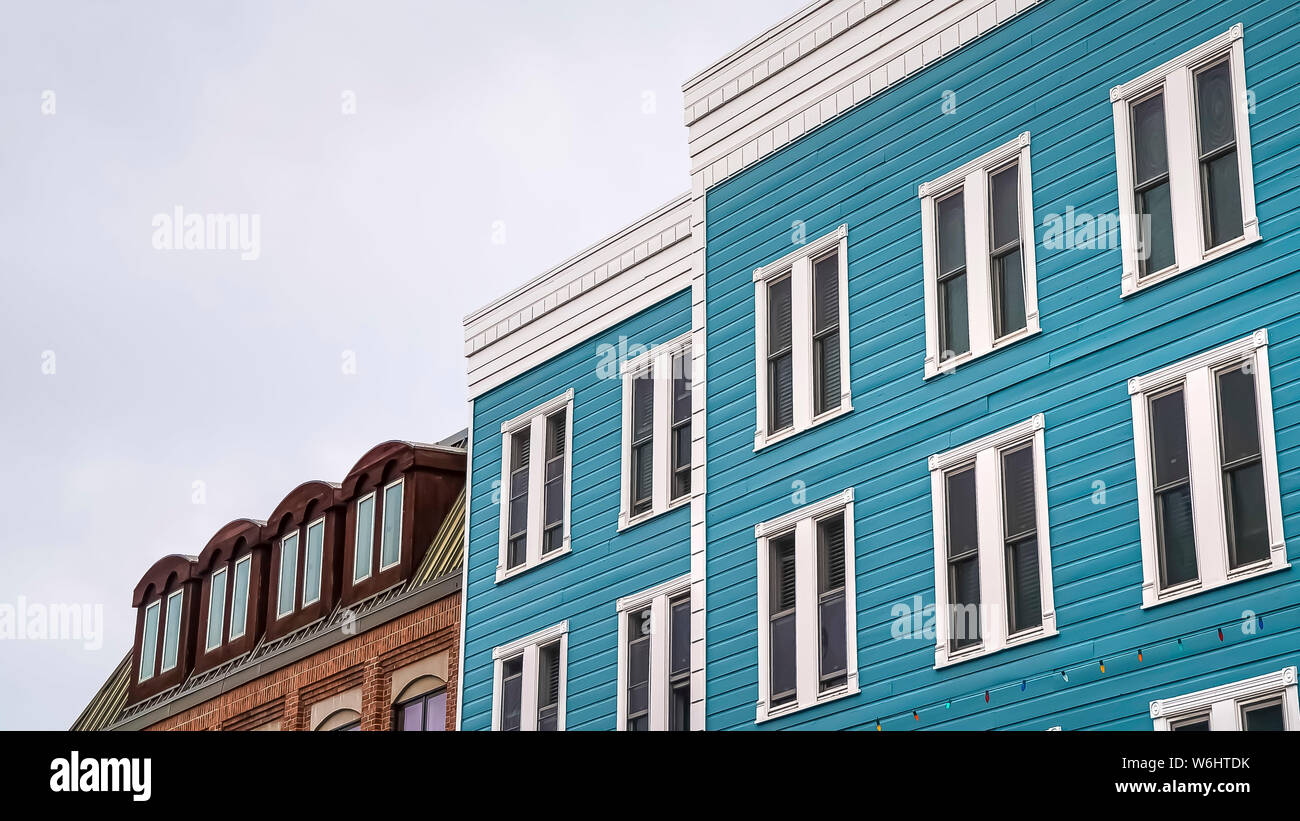 Panorama Residential building with blue exterior wall and vertical ...