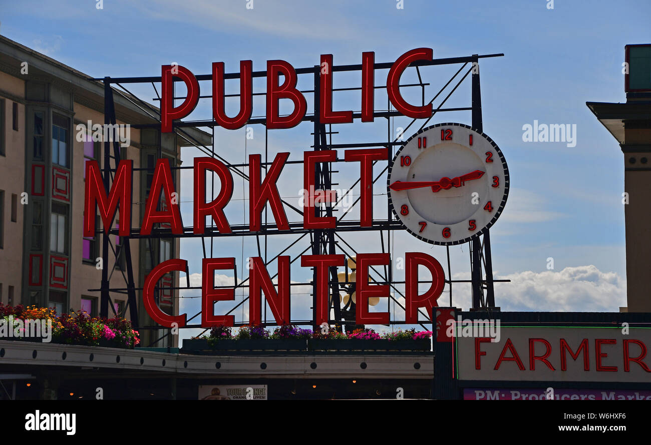 The iconic clock and sign for the Pike Place Market in downtown Seattle ...