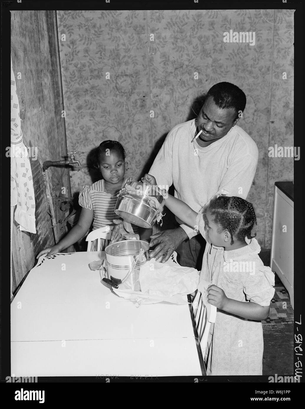 Julius Brooks and his daughters admire new lunch pail. He installed ...