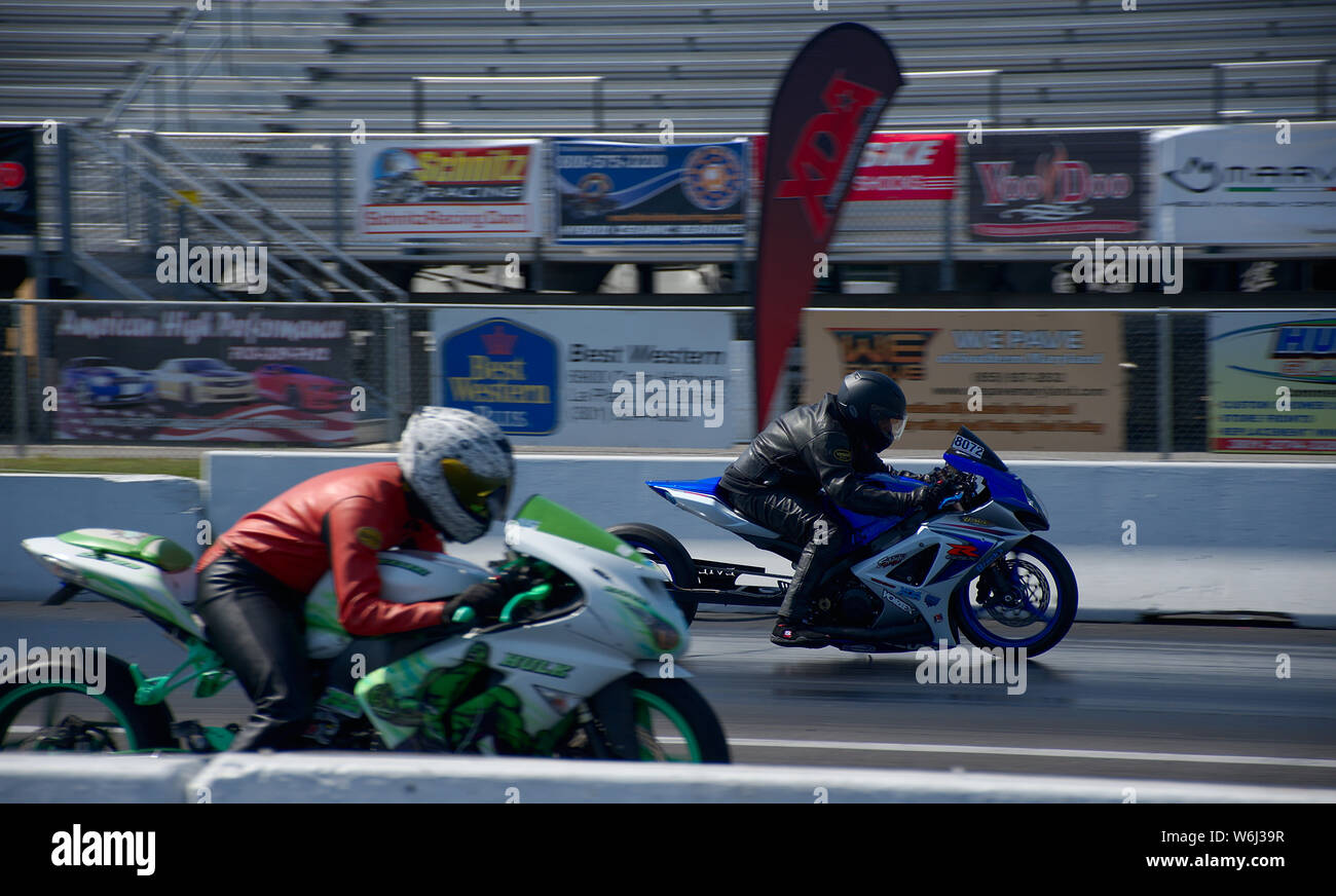 Two motorcycles during drag race at Maryland National Raceway Stock ...