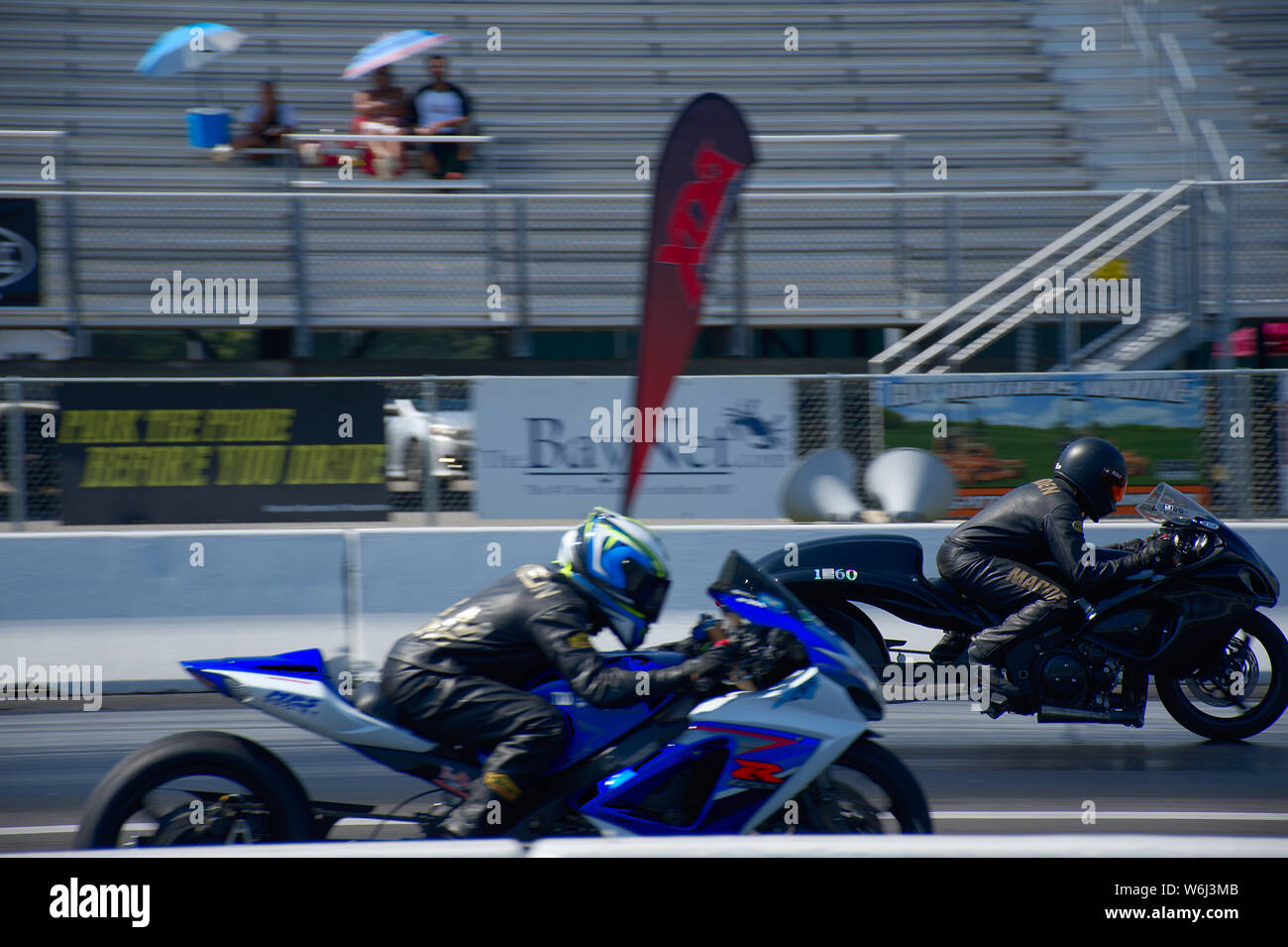 Two motorcycles during drag race at Maryland National Raceway Stock ...
