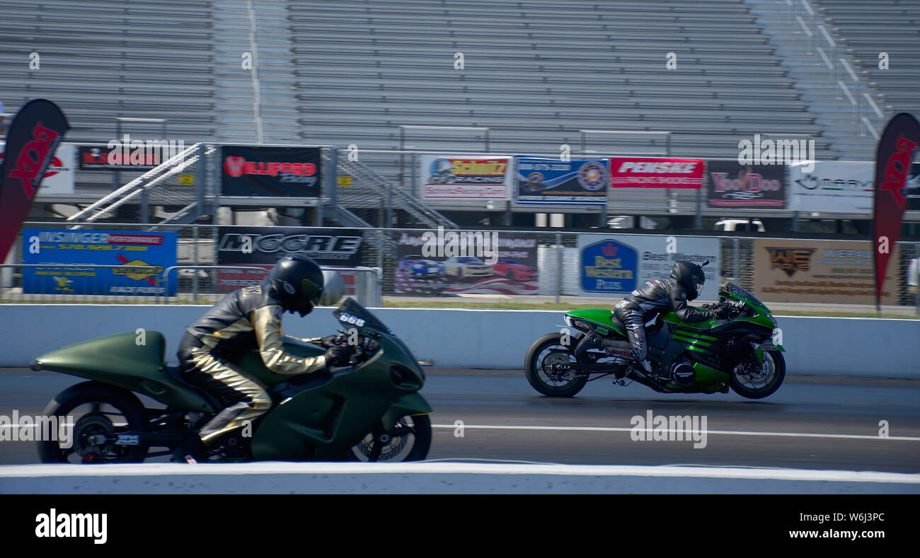 Two motorcycles during drag race at Maryland National Raceway Stock ...