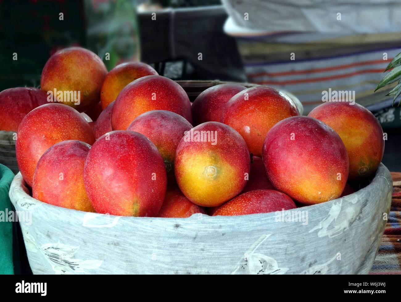 Fresh red Irwin mangoes for sale at an outdoor market Stock Photo - Alamy