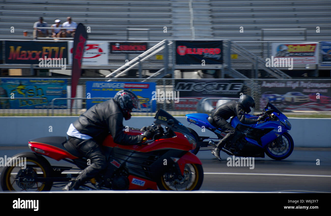 Two motorcycles during drag race at Maryland National Raceway Stock ...