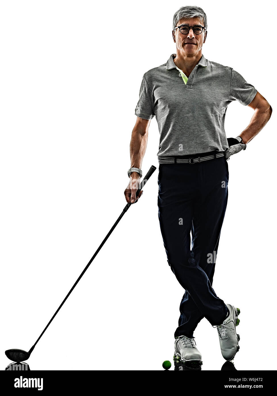 one caucasian senior man golfer golfing in studio shadow silhouette ...