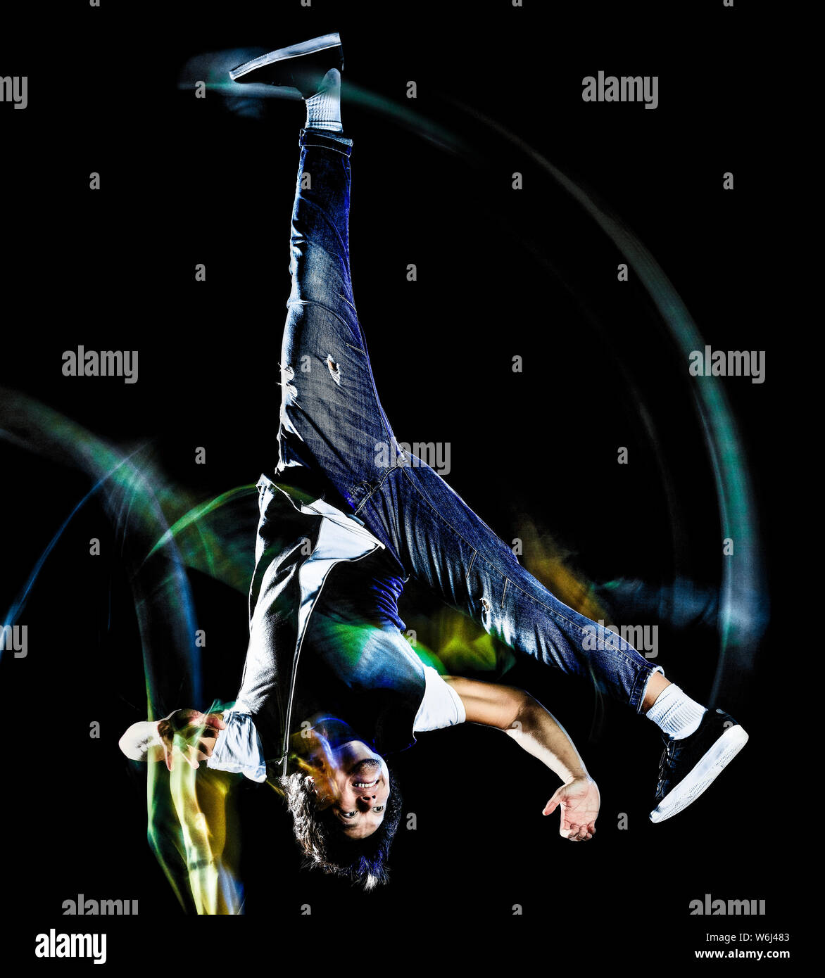 one chinese young man hip hop break dancer dancing isolated on black ...