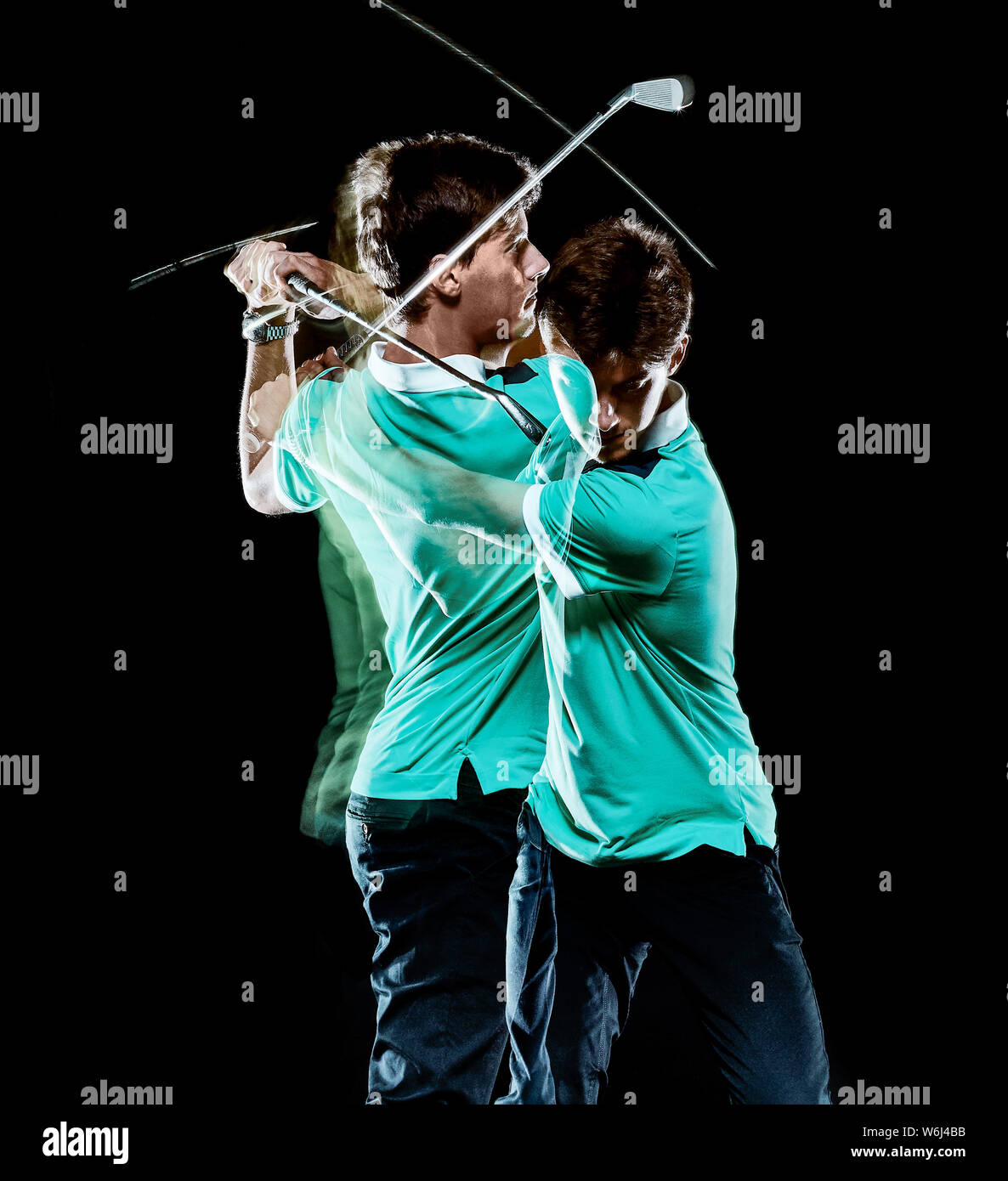 one caucasian young golfer man golfing golf swing isolated on black ...