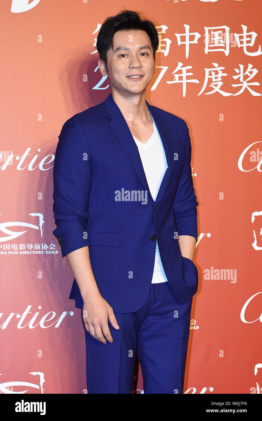 Chinese actor Li Chen poses as he arrives at the red carpet for the 9th ...