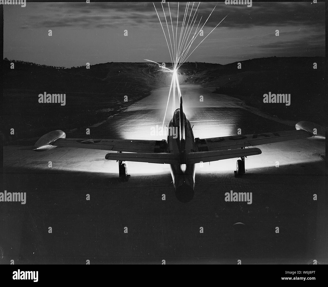 Leaving a fiery trail, .50 caliber bullets streak through the night as ...