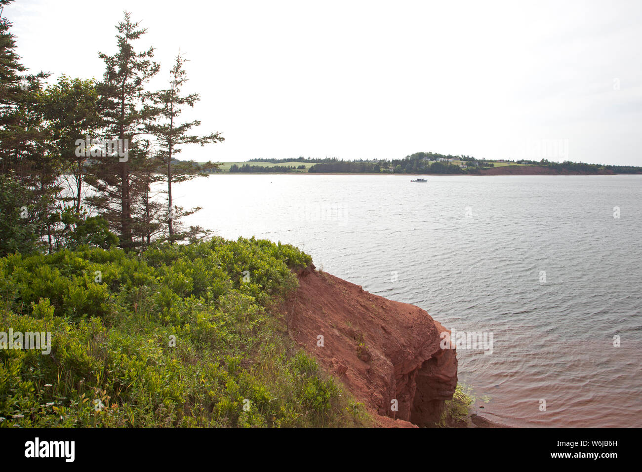 Red cliffs overlook the Atlantic ocean in Prince Edward Island Stock ...