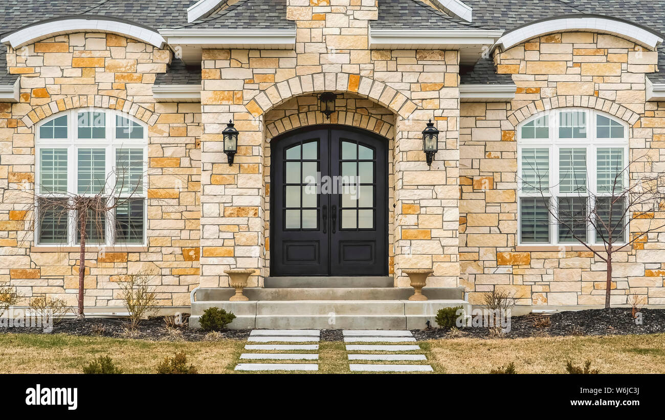 Panorama frame Home facade with stone brick wall double glass paned ...