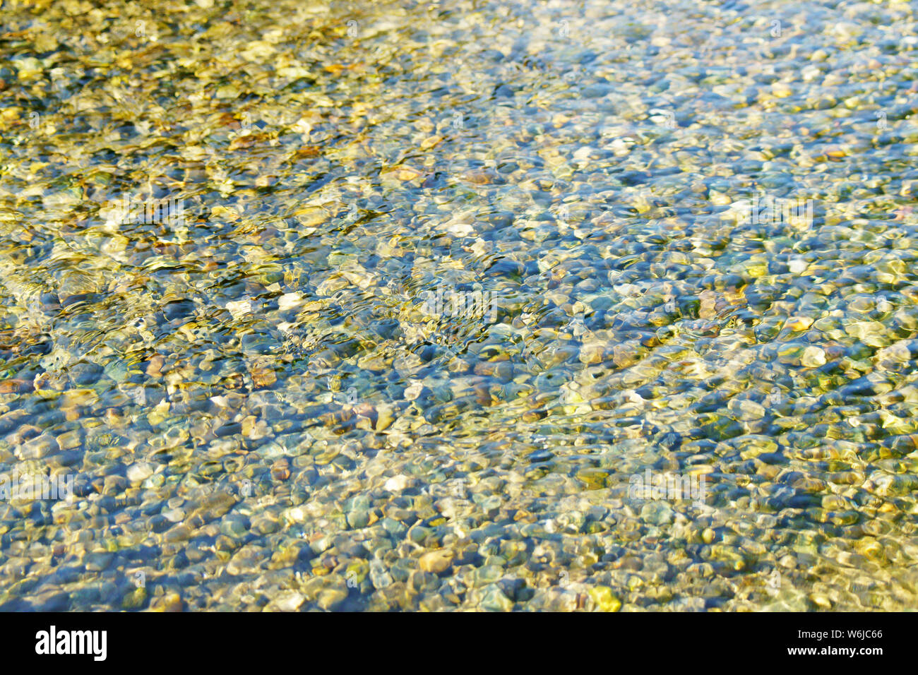 Stream flowing spring water Stock Photo - Alamy