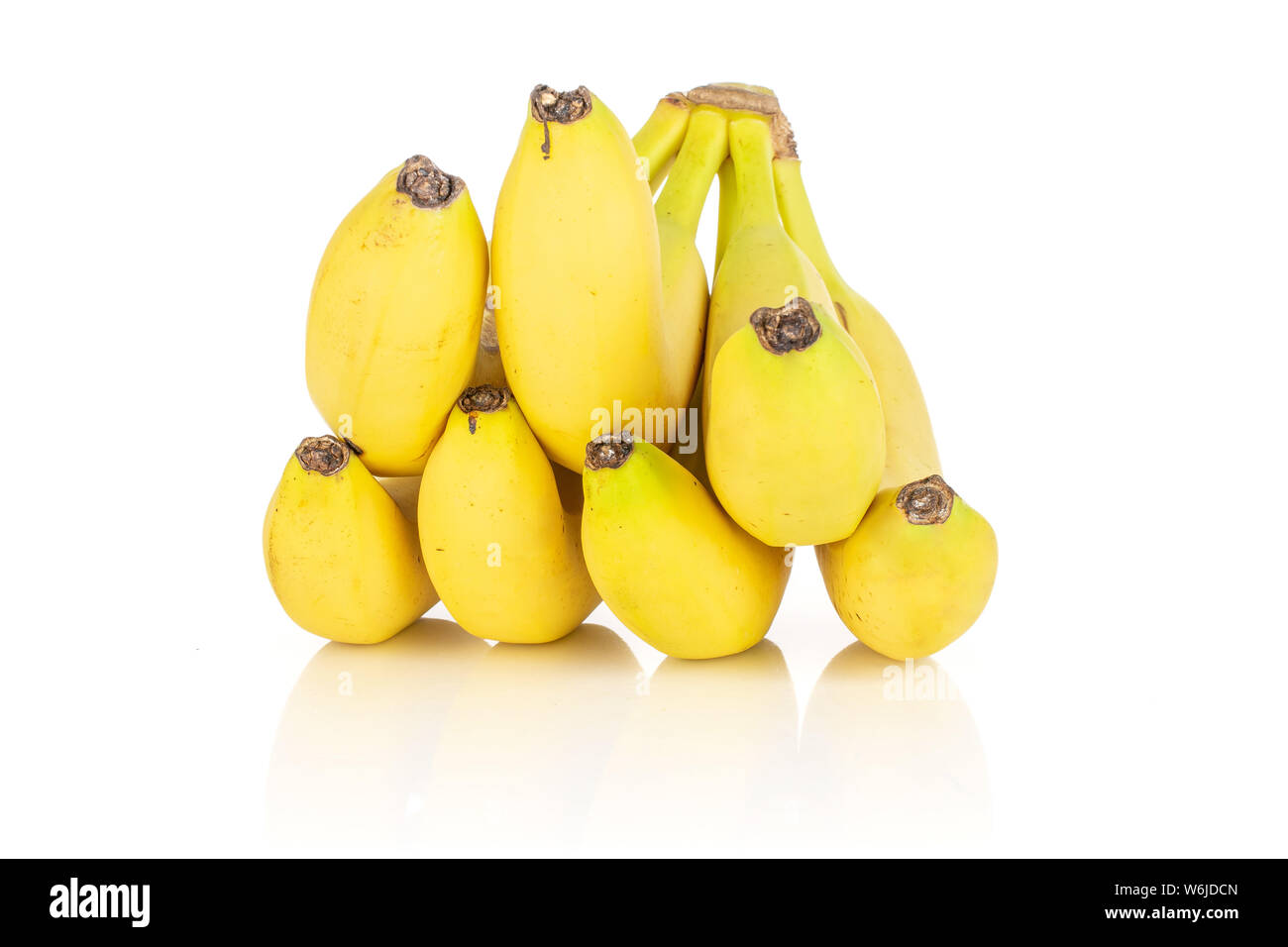 Lot of whole ripe yellow banana from the front isolated on white ...