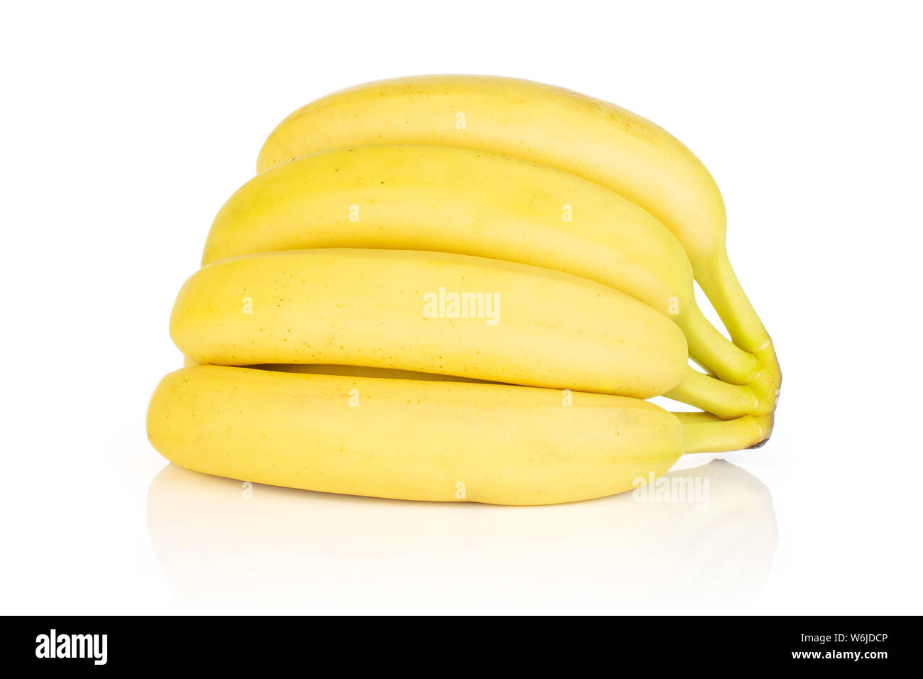 Group of four whole ripe yellow banana isolated on white background ...
