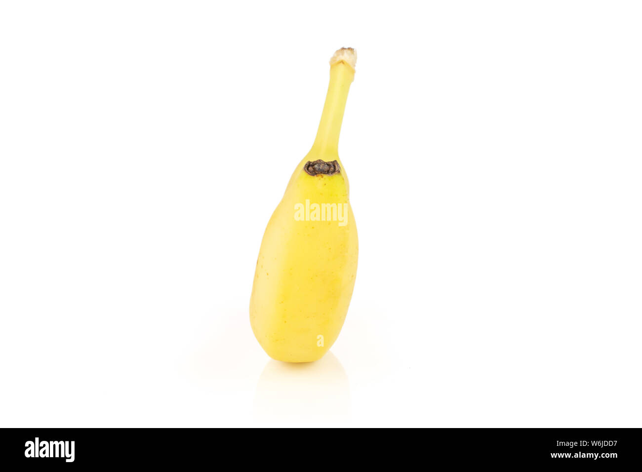 One whole ripe yellow banana from the front isolated on white ...