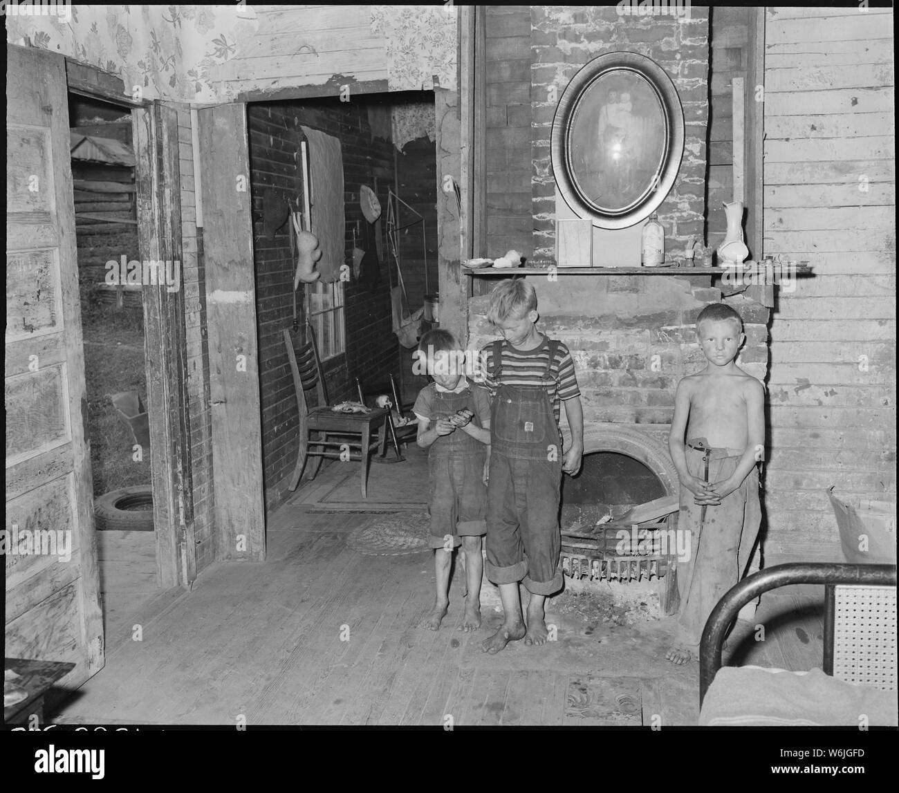 Miners children in front of the fireplace in Monroe Jones' four room ...