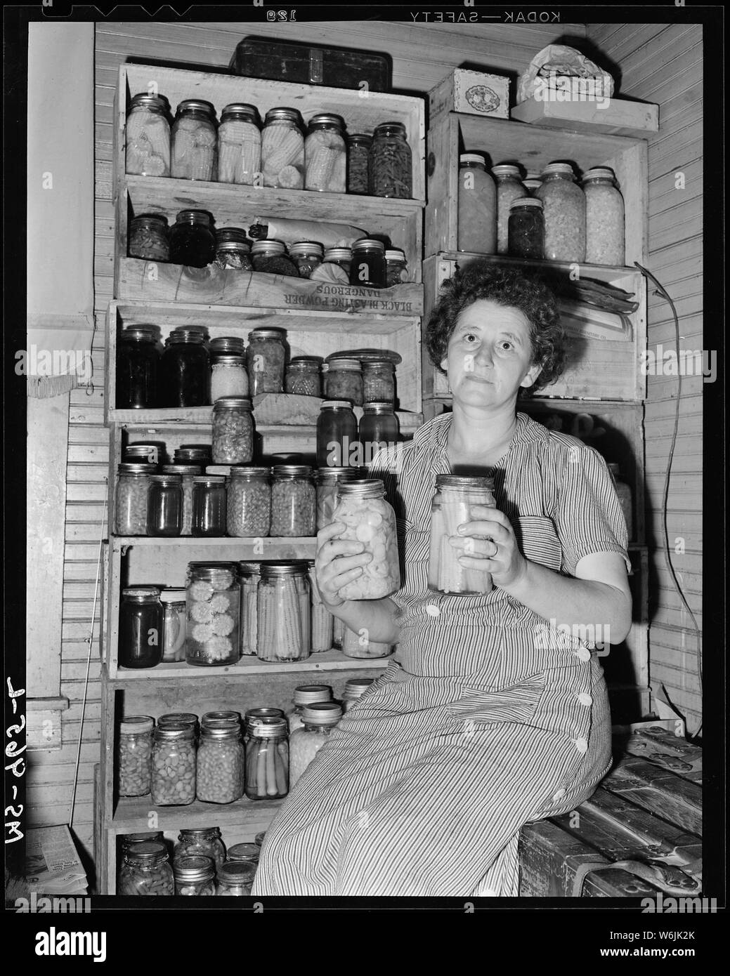 Mrs. Mack Brasseak, wife of miner, with some of the vegetables she has ...