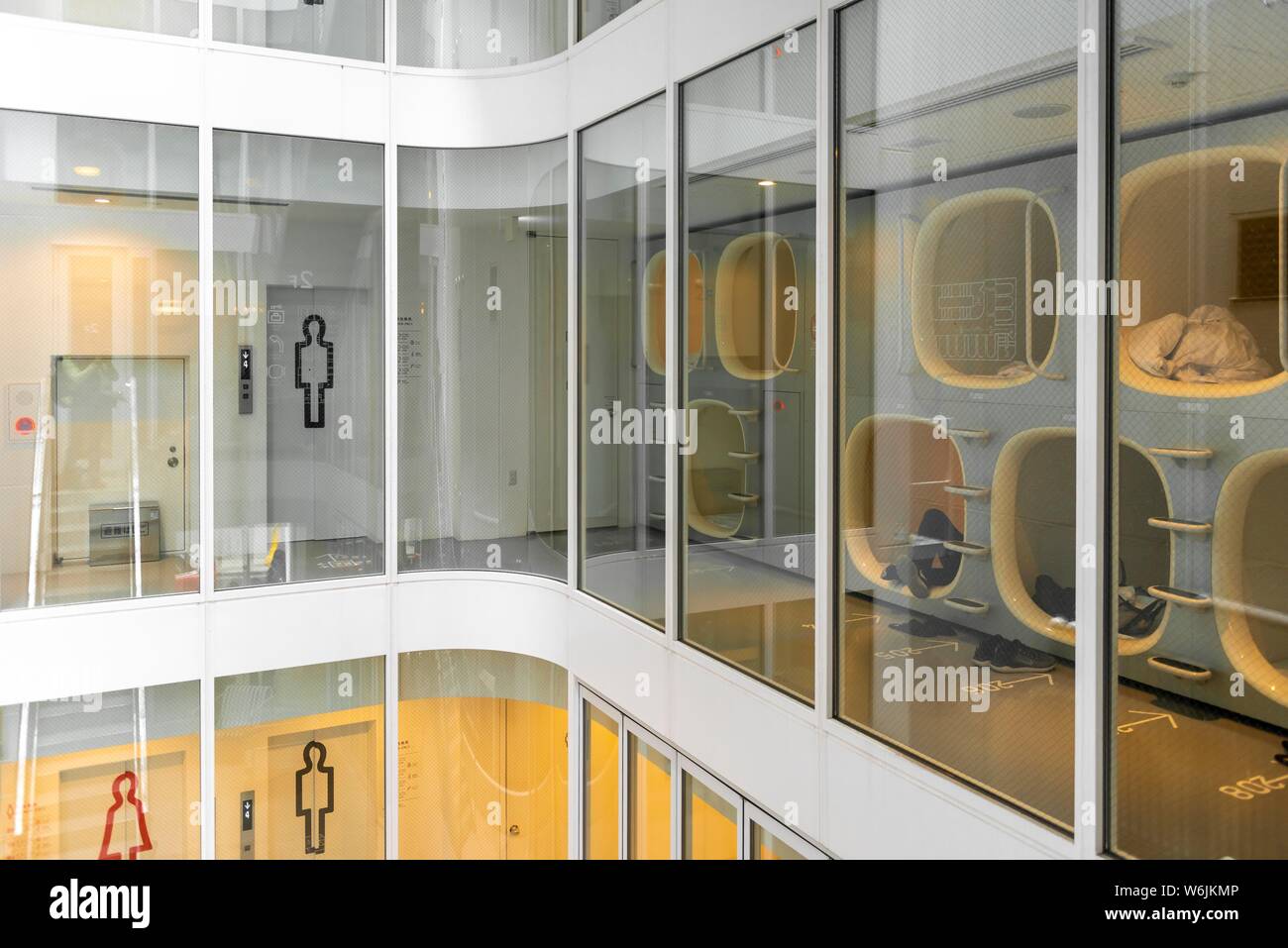 Sleeping capsules in 9hours Hotel, capsule hotel, Tokyo, Japan Stock ...