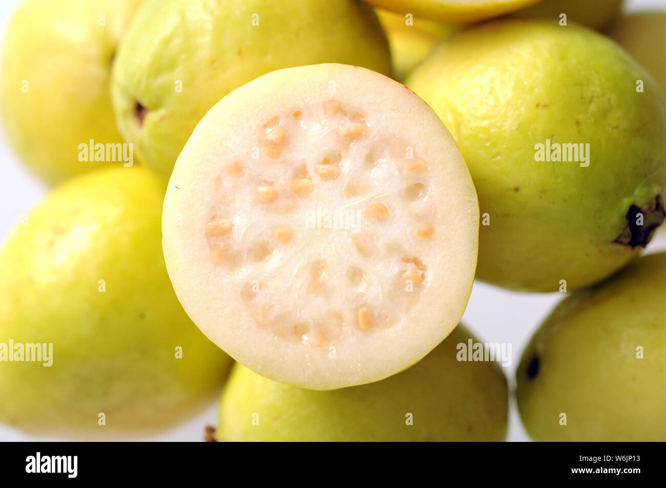 chopped and whole guava on white Stock Photo - Alamy