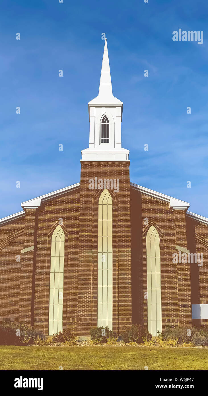 Vertical frame Exterior view of a magnificent church with cloudy blue ...