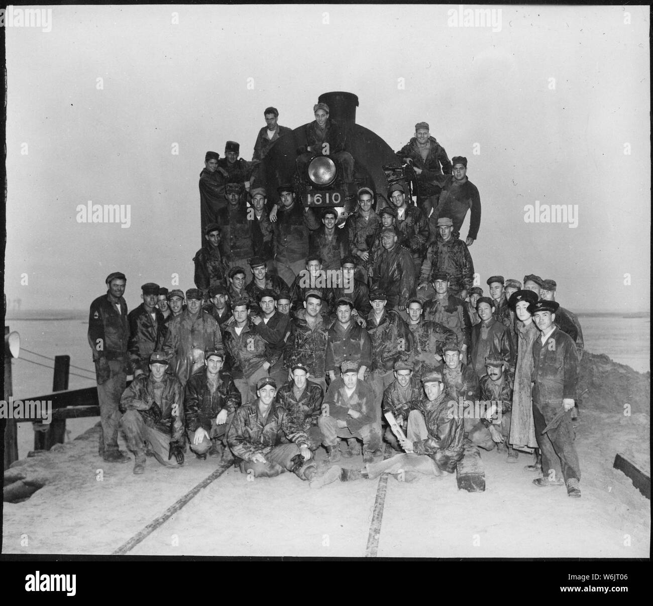 Officers and men of the 62nd Engineers stand in front of the first ...