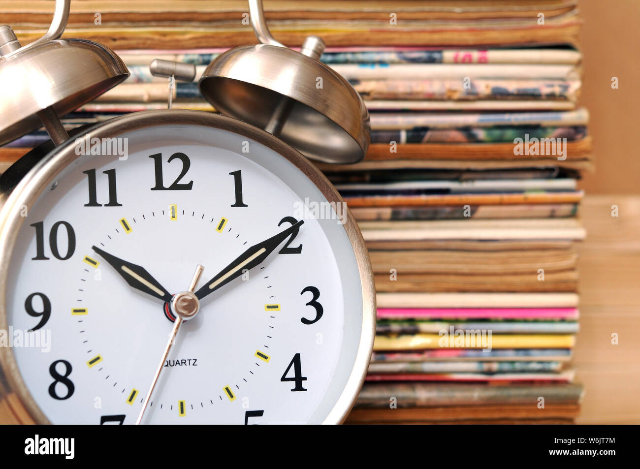 clock with old magazine for time for learning concept Stock Photo - Alamy