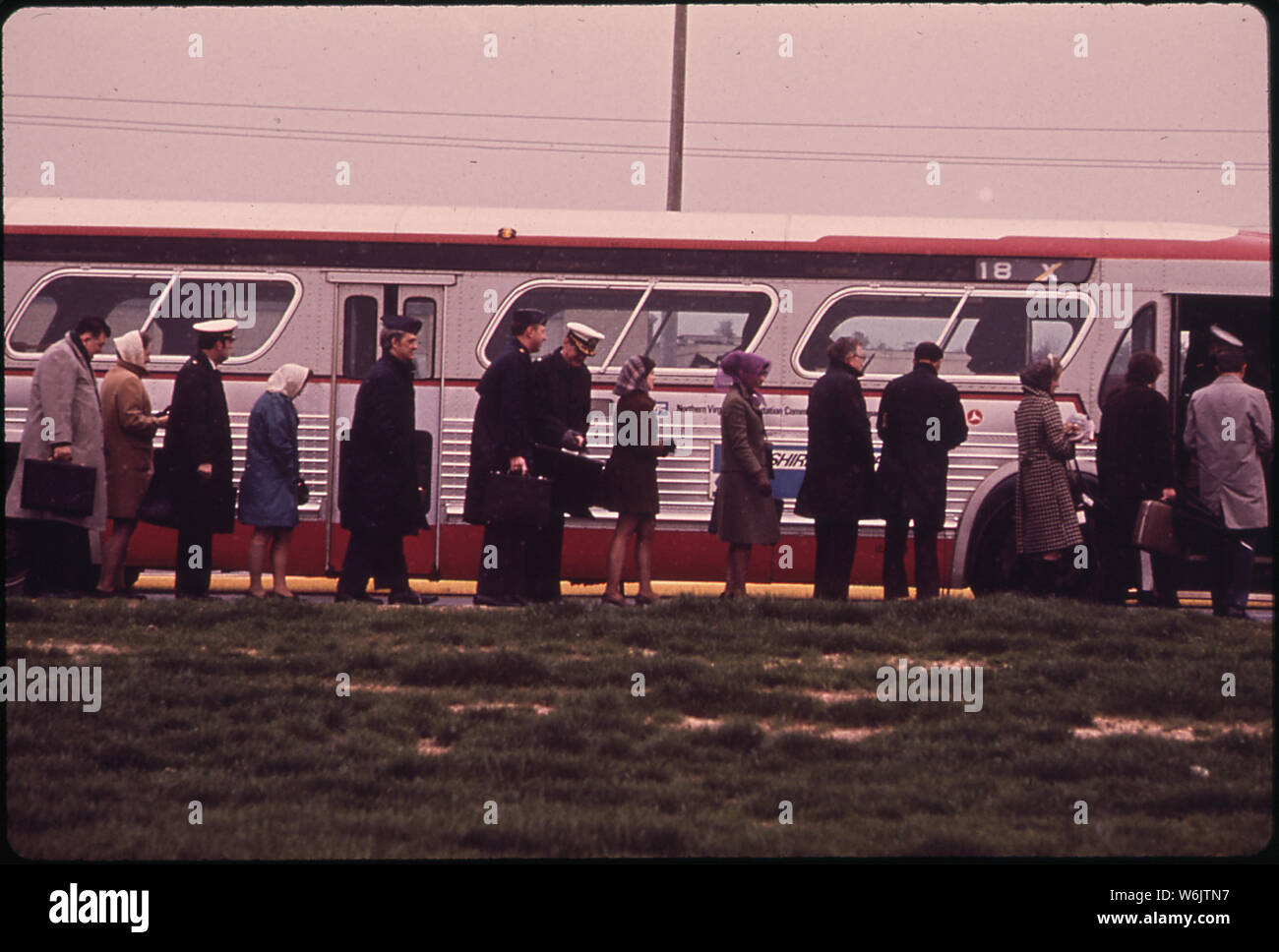 PARK AND RIDE STATION IN SPRINGFIELD, VA. THESE PASSENGERS ARE LINED UP ...