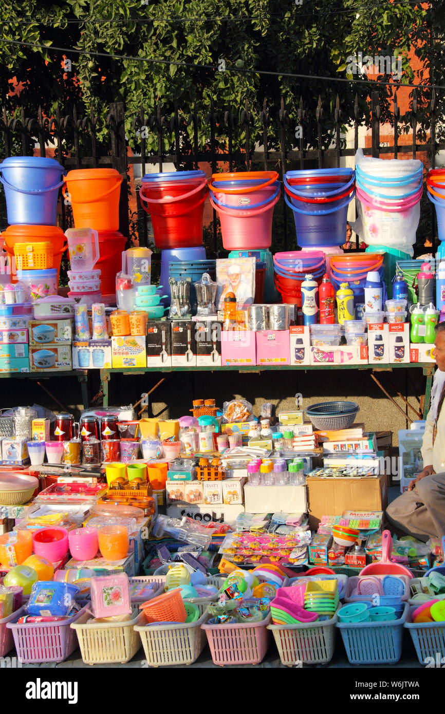 Plastic items displayed at a market stall Stock Photo - Alamy