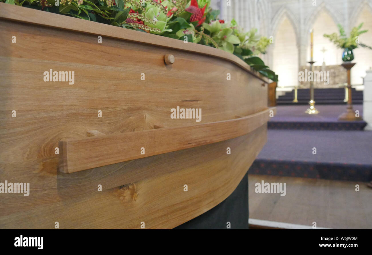 closeup shot of a funeral casket in a hearse or chapel or burial at ...